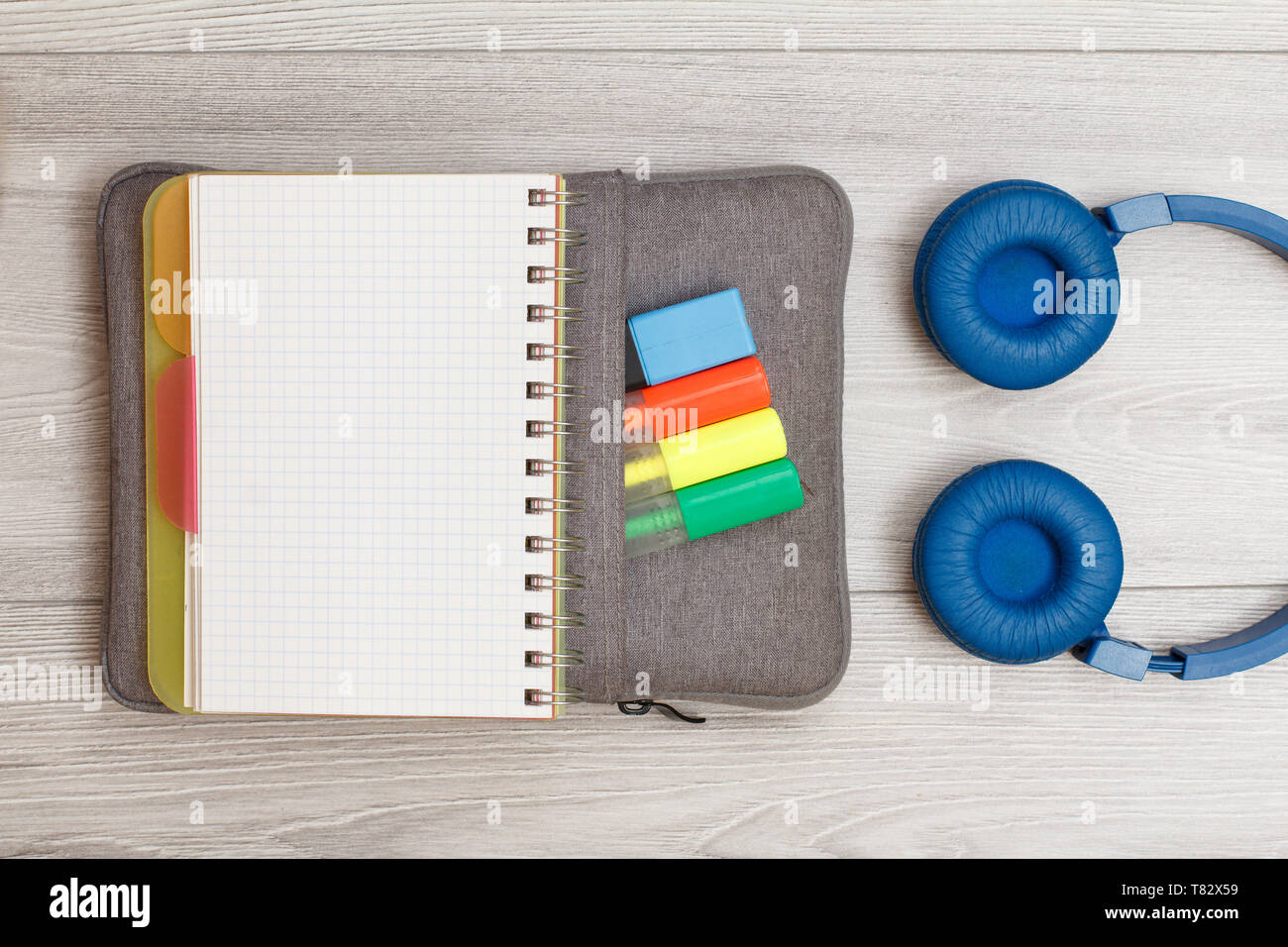 School supplies. Open exercise book on bag-pencil case with color felt ...