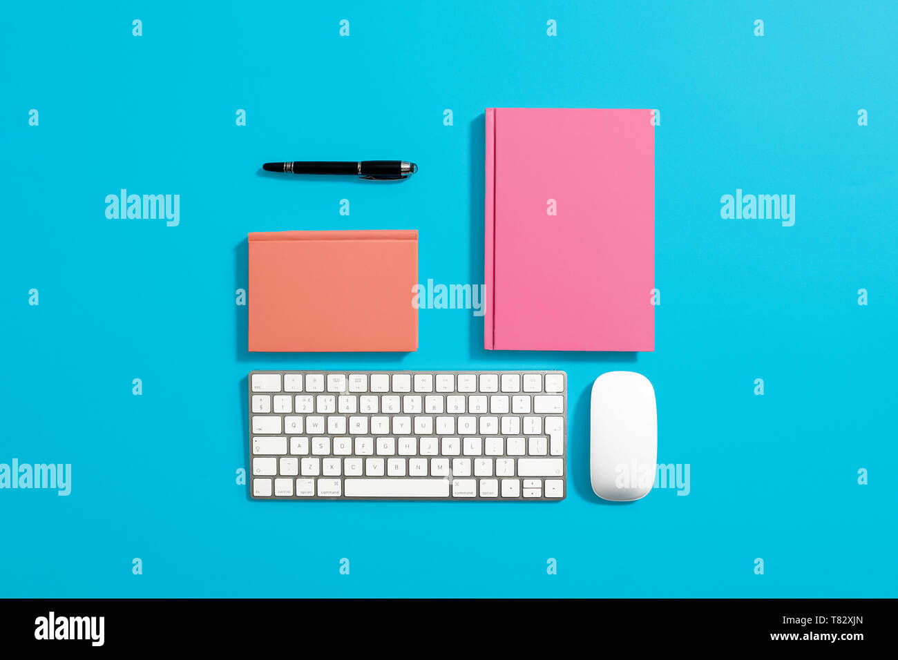 Orange hardcover notebook, diary, journal on a blue background with ...