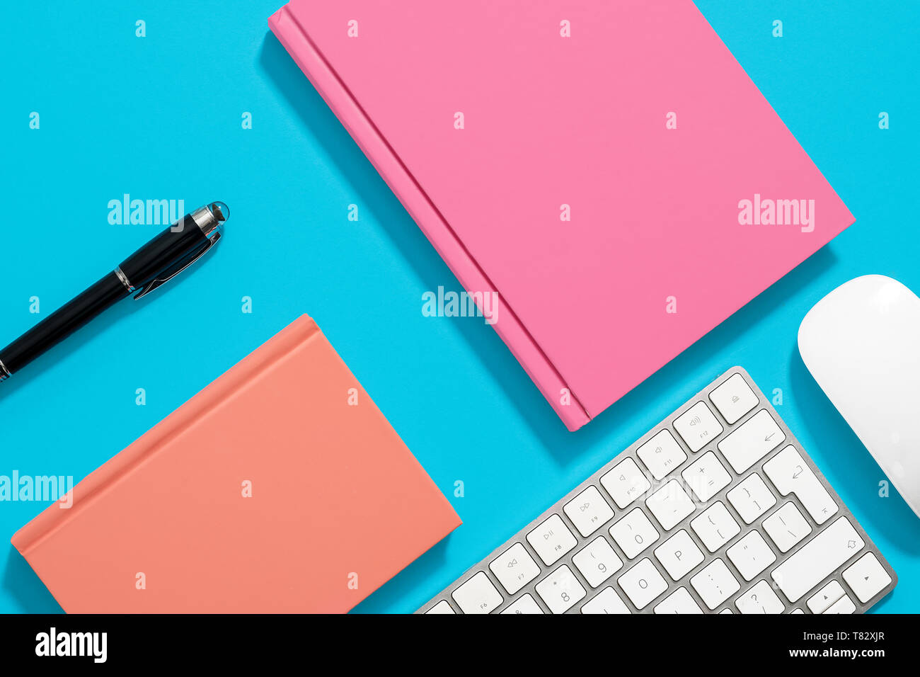 Orange hardcover notebook, diary, journal on a blue background with ...