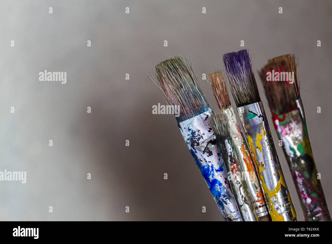 Paint brushes with visible paint marks on plain background Stock Photo ...