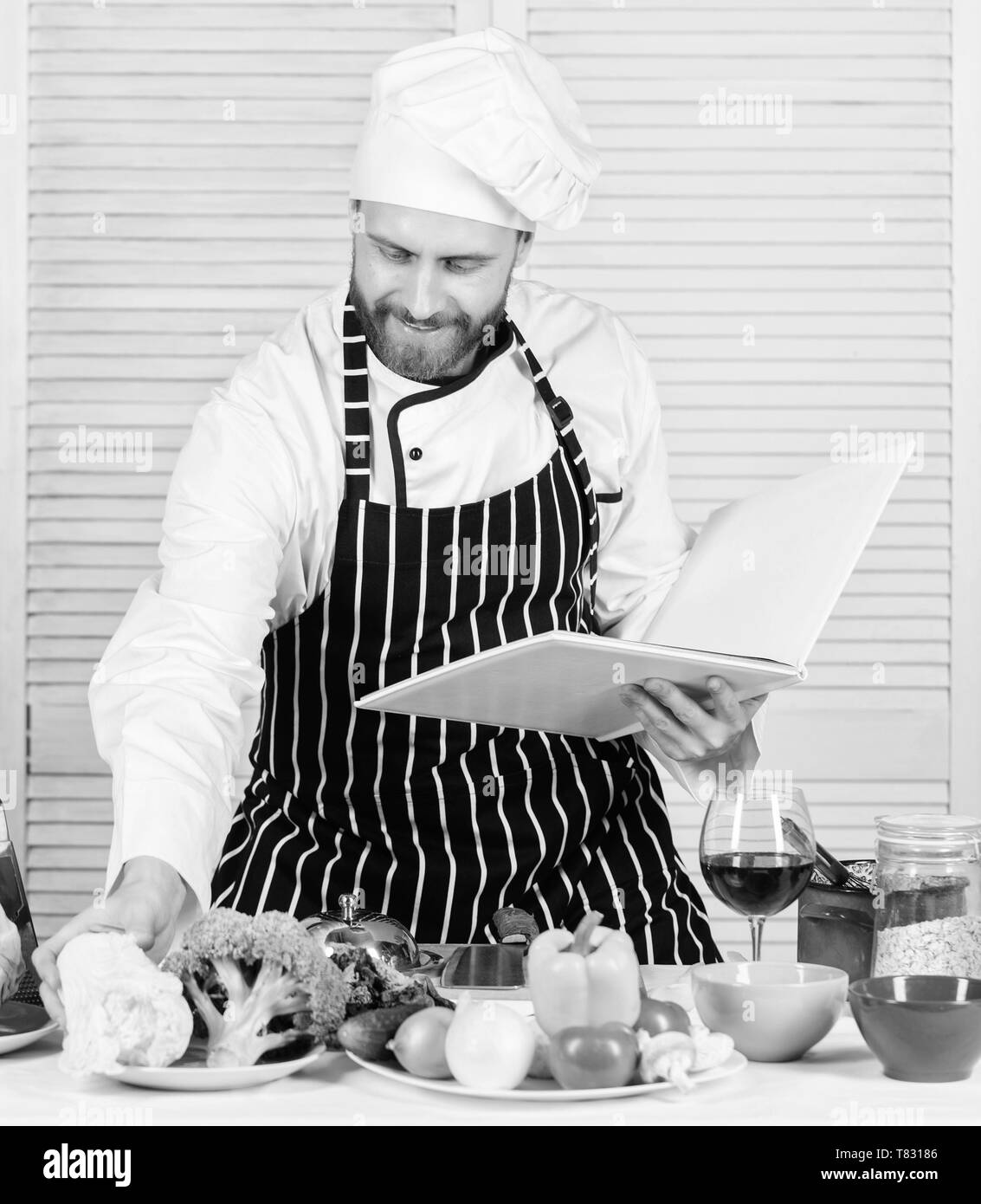 Culinary arts concept. Man learn recipe. Improve cooking skill. Book ...