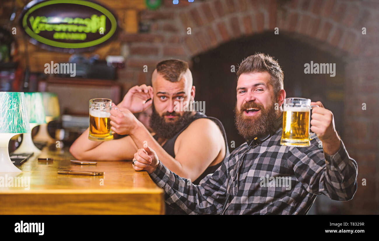 Men drunk relaxing having fun. Alcohol drinks. Friends relaxing in pub ...