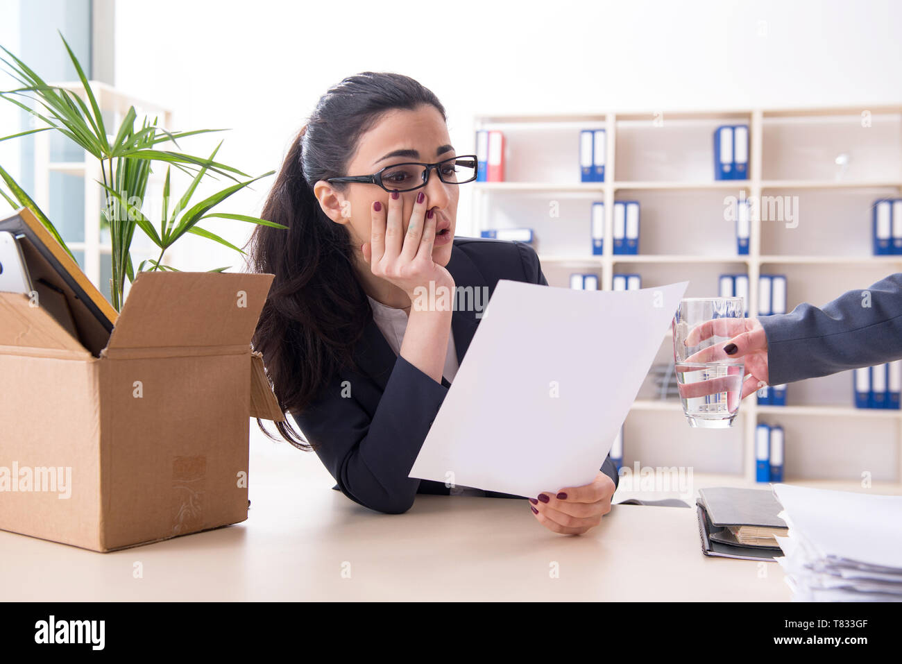 Young female employee being fired from her work Stock Photo - Alamy