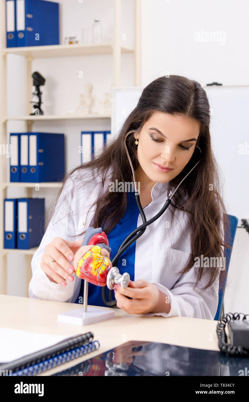 Female doctor cardiologist working in the clinic Stock Photo - Alamy