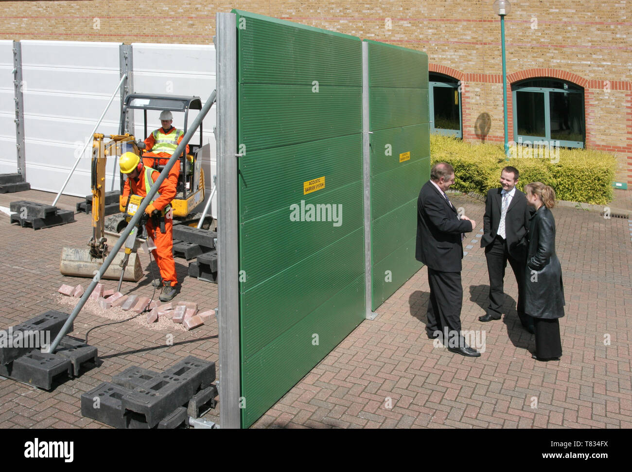 Temporary acoustic screens allow office workers to hold a conversation ...