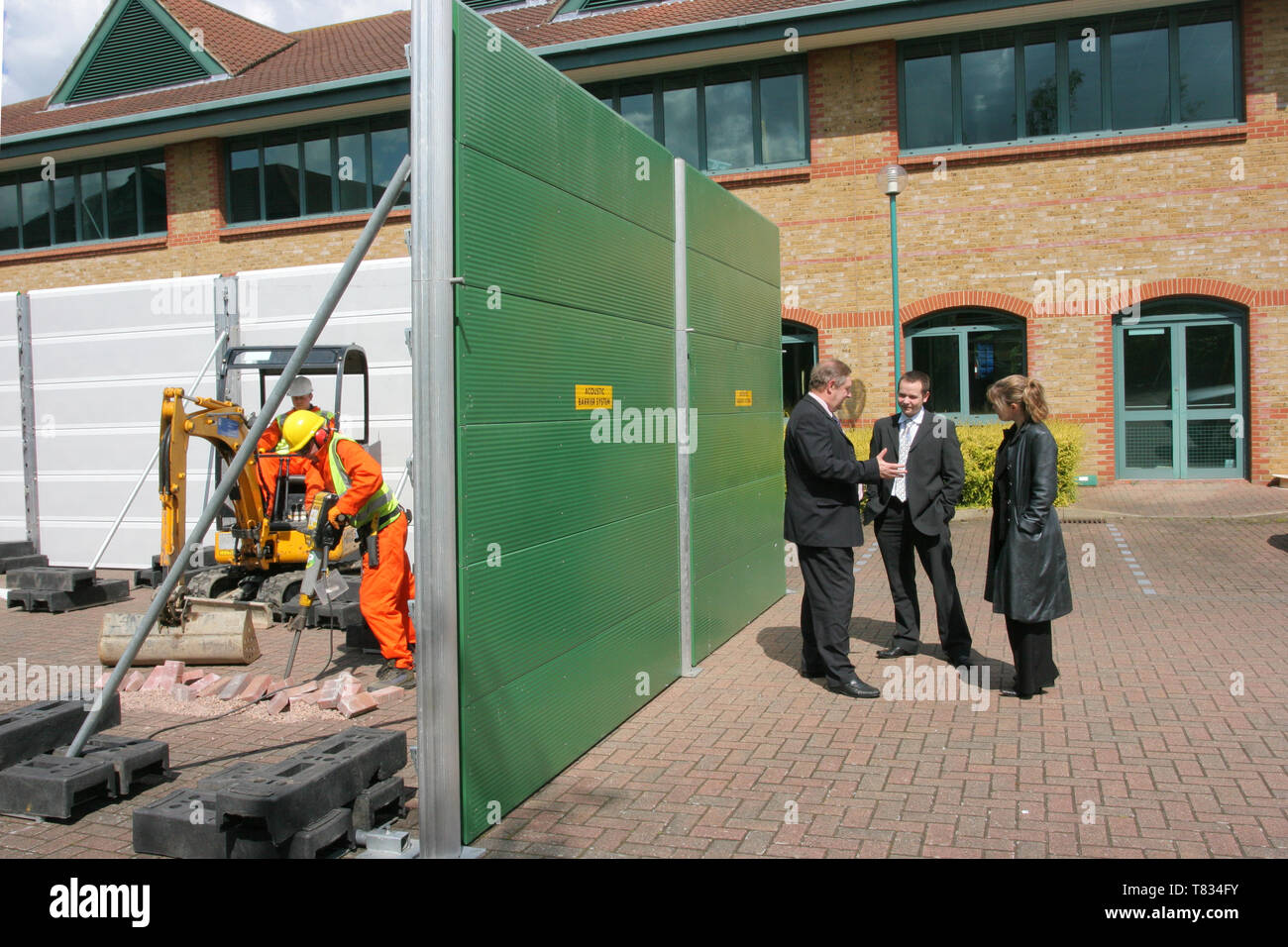 Temporary acoustic screens allow office workers to hold a conversation ...