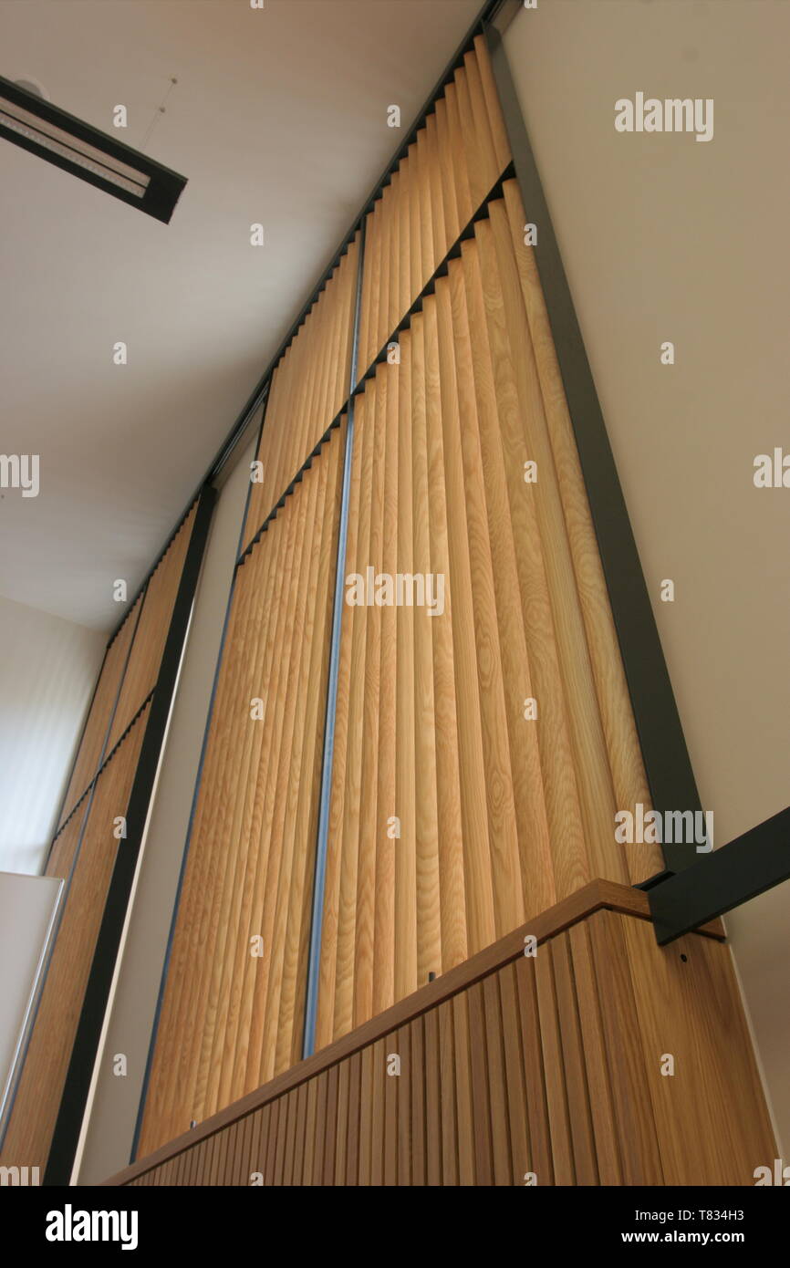 Close-up of 4m high, sliding, internal timber window shutters in the KO ...