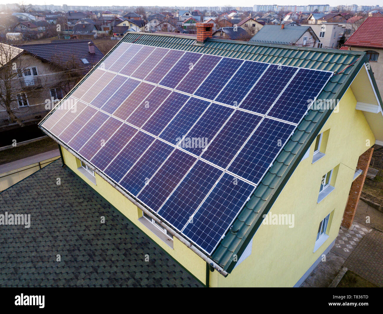 Aerial top view of new modern residential house cottage with blue shiny ...