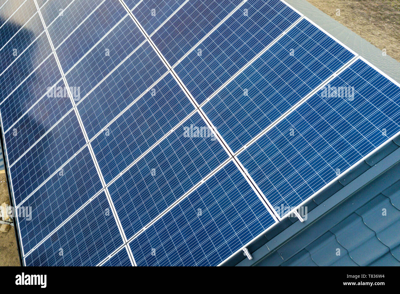Close-up surface of blue shiny solar photo voltaic panels system on ...