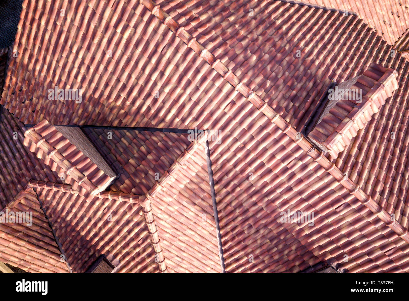 Top aerial view of building complex shingle roof construction. Abstract ...