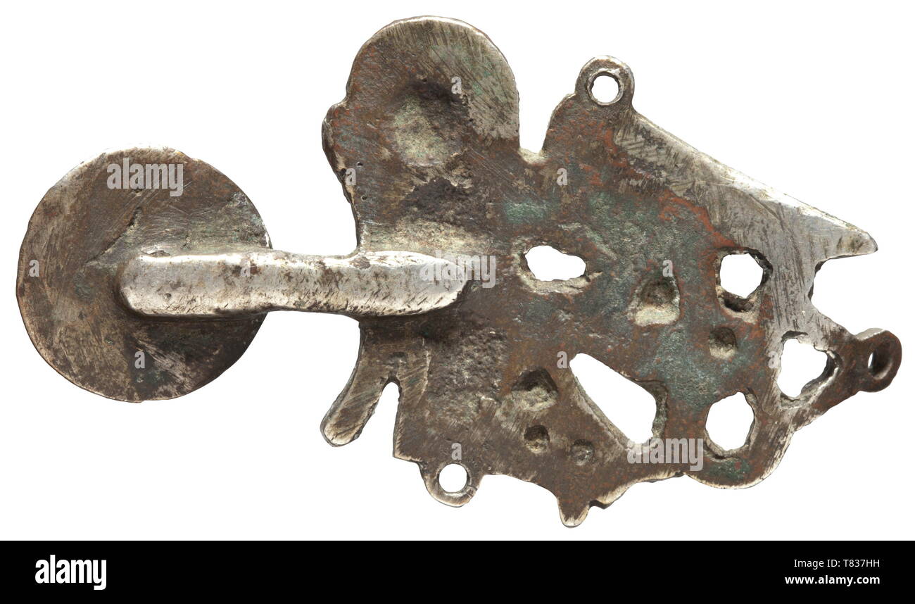 A Romanesque silver coat clasp, 12th century Openwork cast and engraved ...