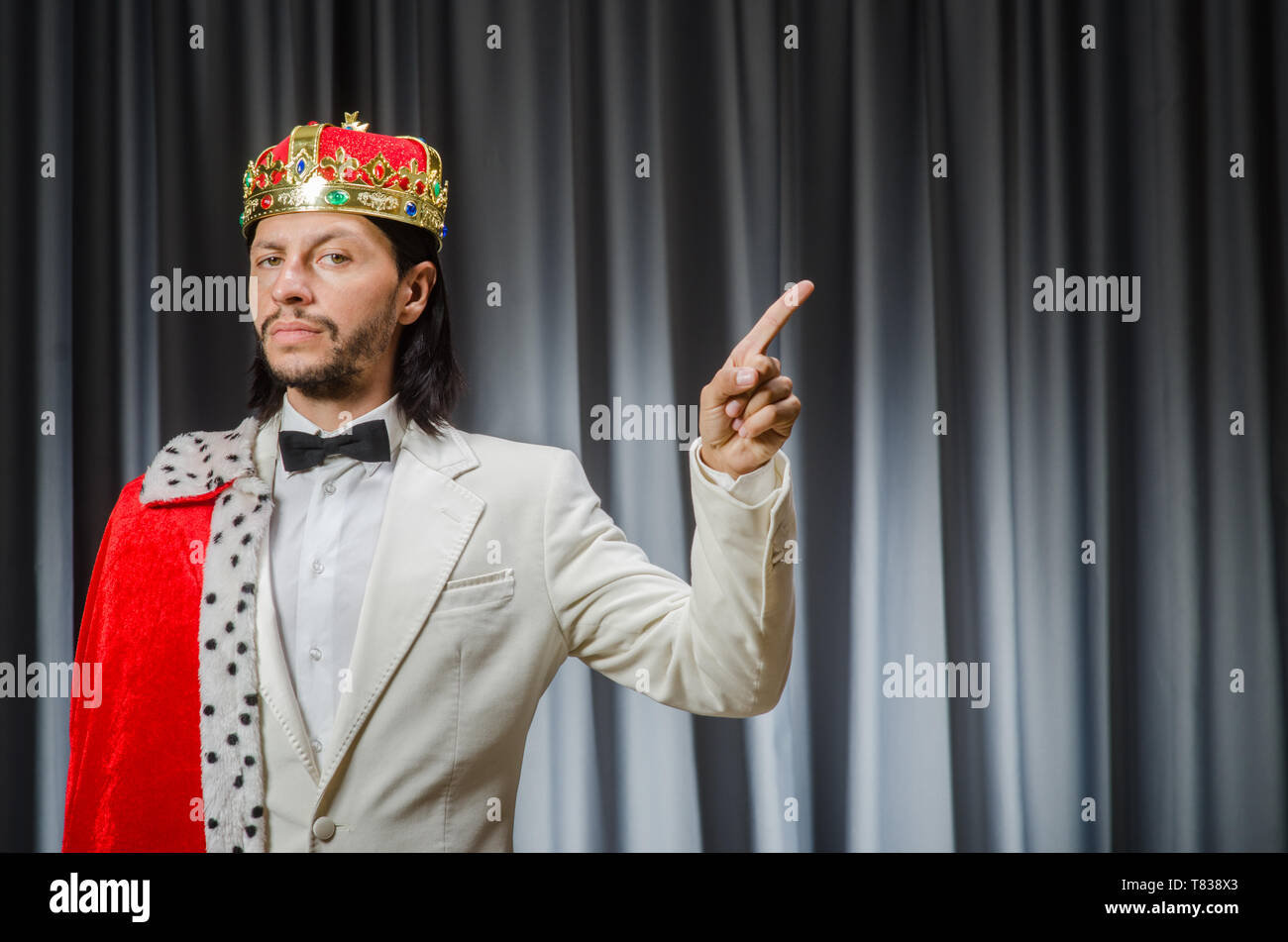 Funny king wearing crown in coronation concept Stock Photo - Alamy