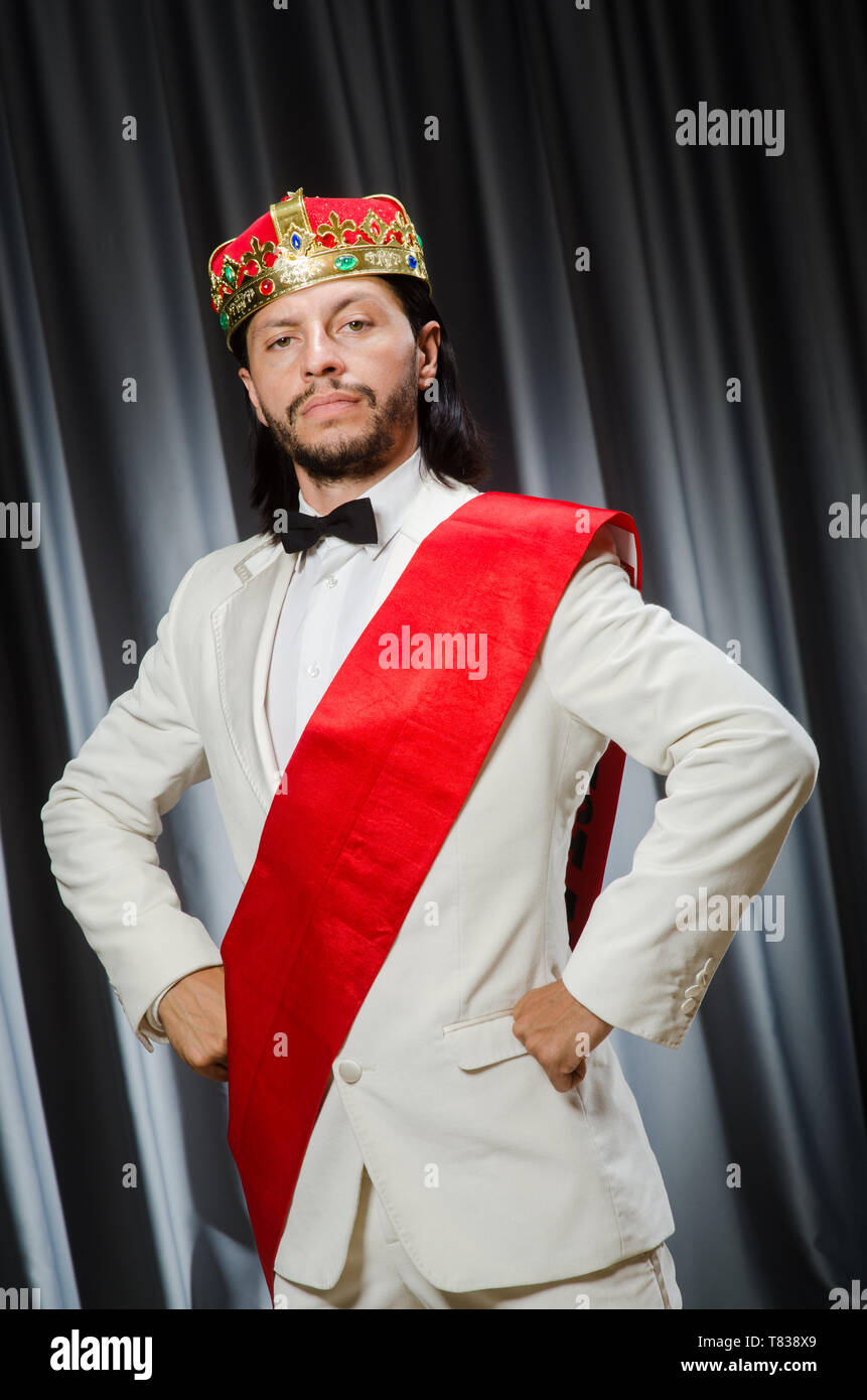 Funny king wearing crown in coronation concept Stock Photo - Alamy