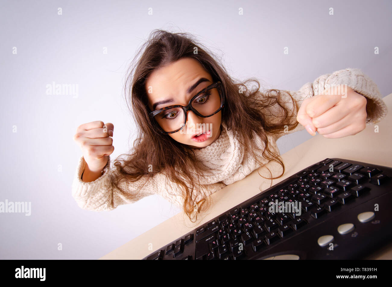 Funny nerd girl working on computer Stock Photo - Alamy