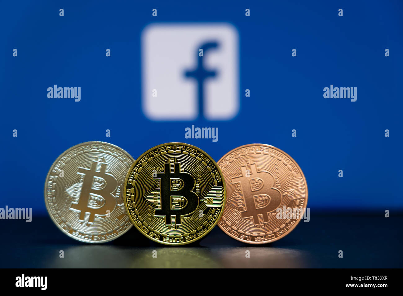 Bitcoin coin with the Facebook logo screen background Stock Photo - Alamy