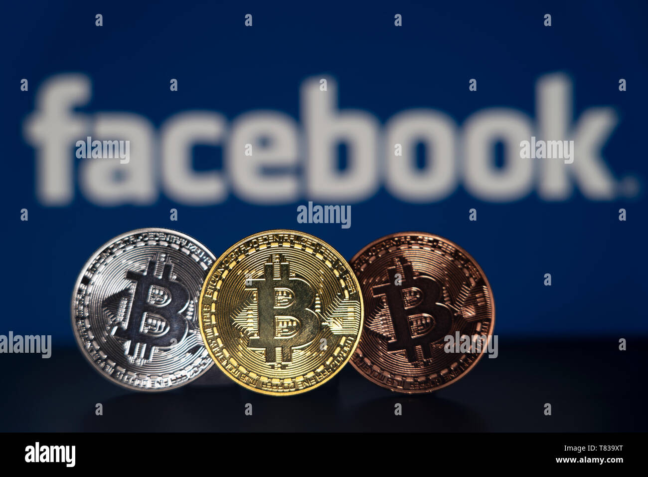 Bitcoin coin with the Facebook logo screen background Stock Photo - Alamy