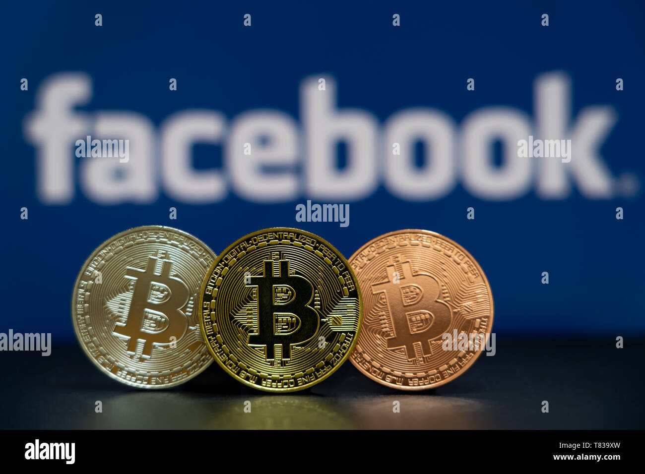 Bitcoin coin with the Facebook logo screen background Stock Photo - Alamy