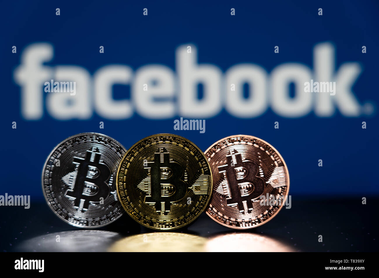 Bitcoin coin with the Facebook logo screen background Stock Photo - Alamy