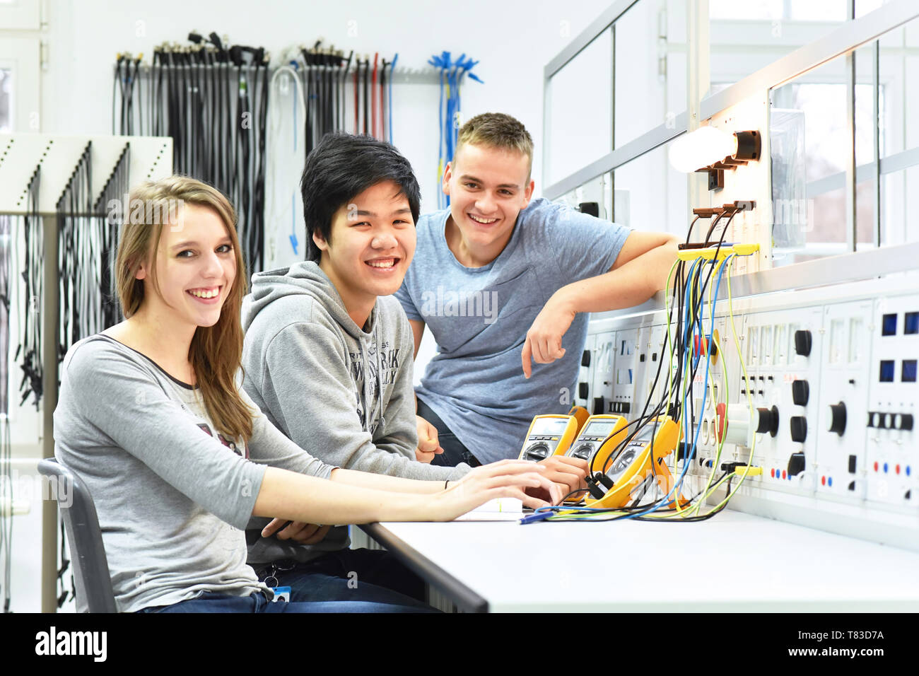 group of cheerful young students in vocational education and training ...