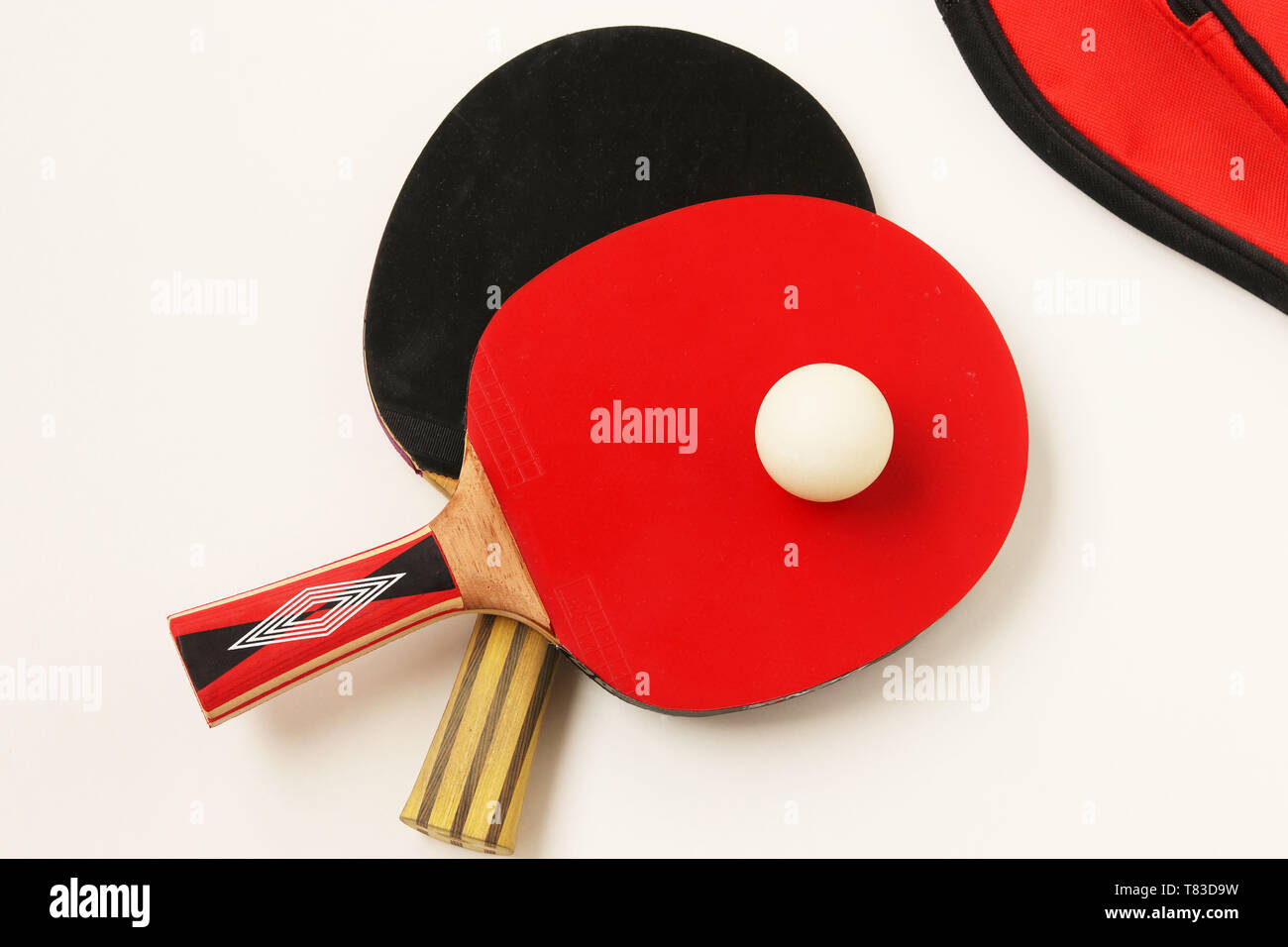 Red and black rackets for playing table tennis on a white background ...