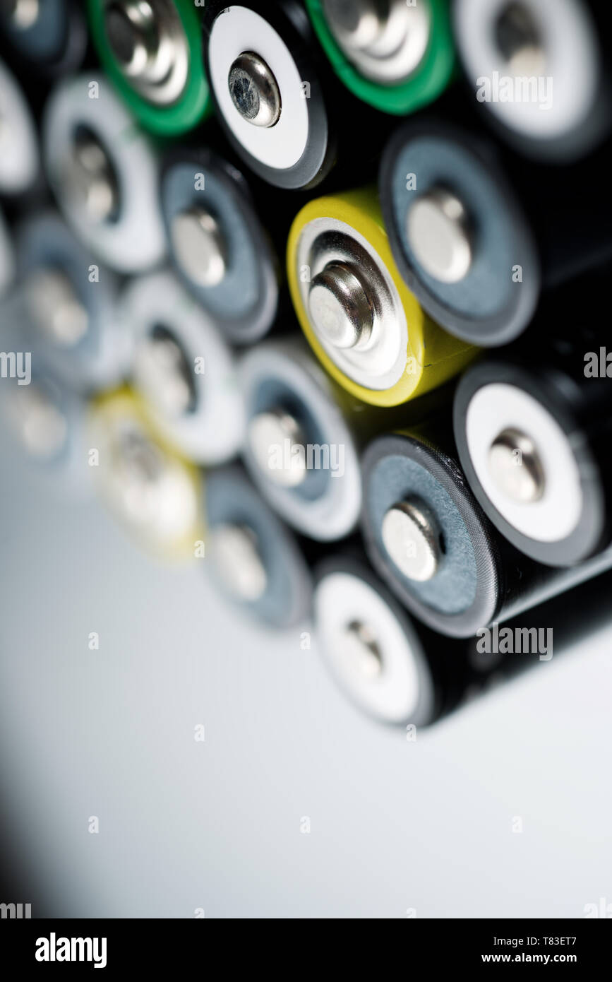 Many batteries on a metal table Stock Photo - Alamy