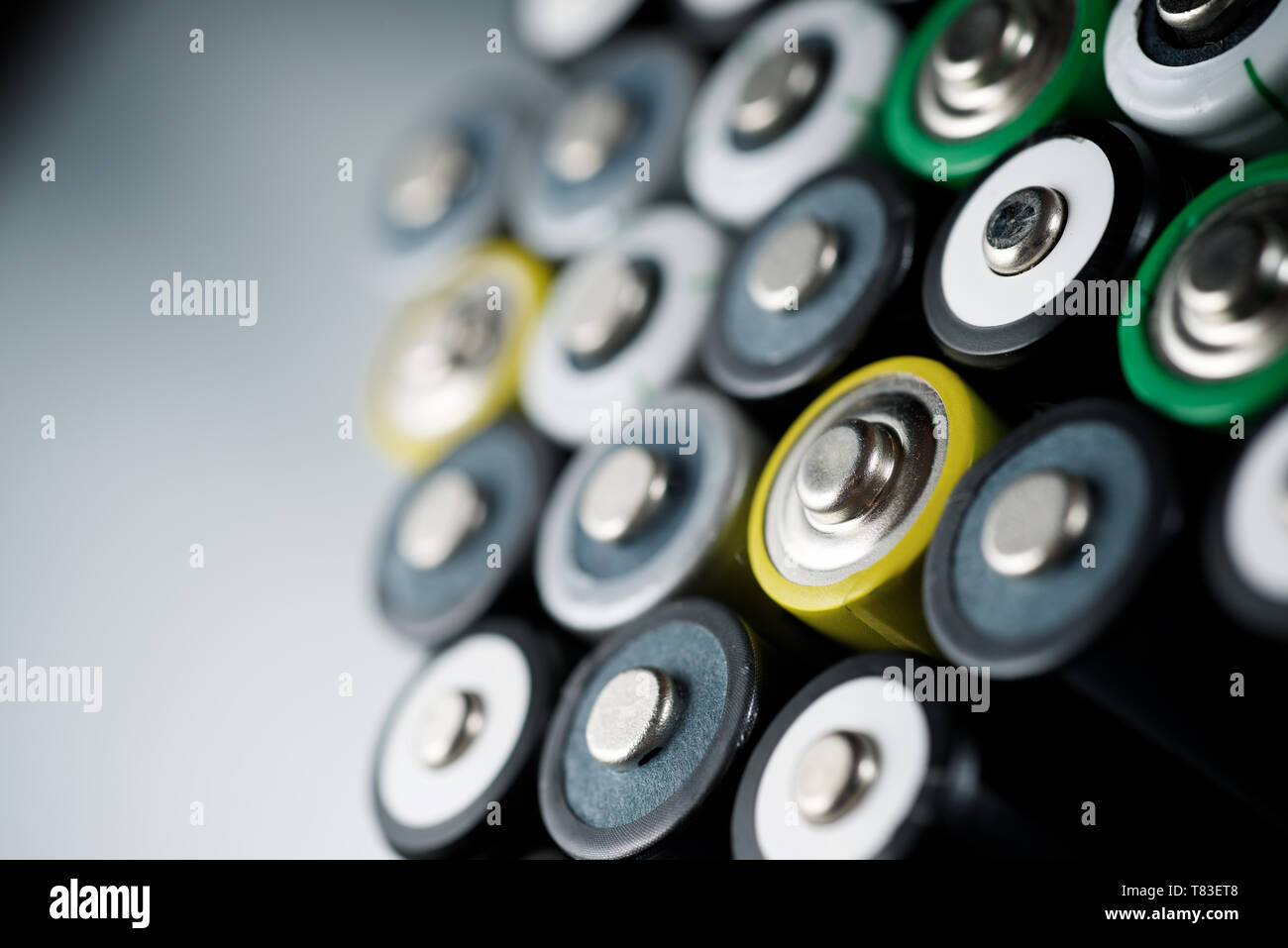 Many batteries on a metal table Stock Photo - Alamy