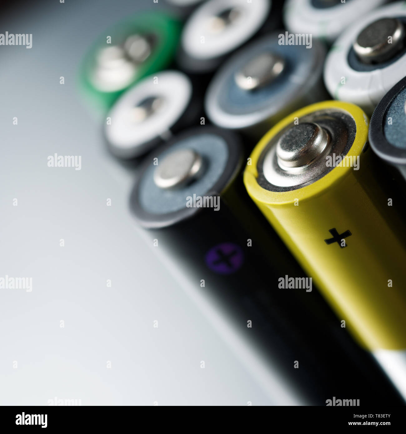 Many batteries on a metal table Stock Photo - Alamy