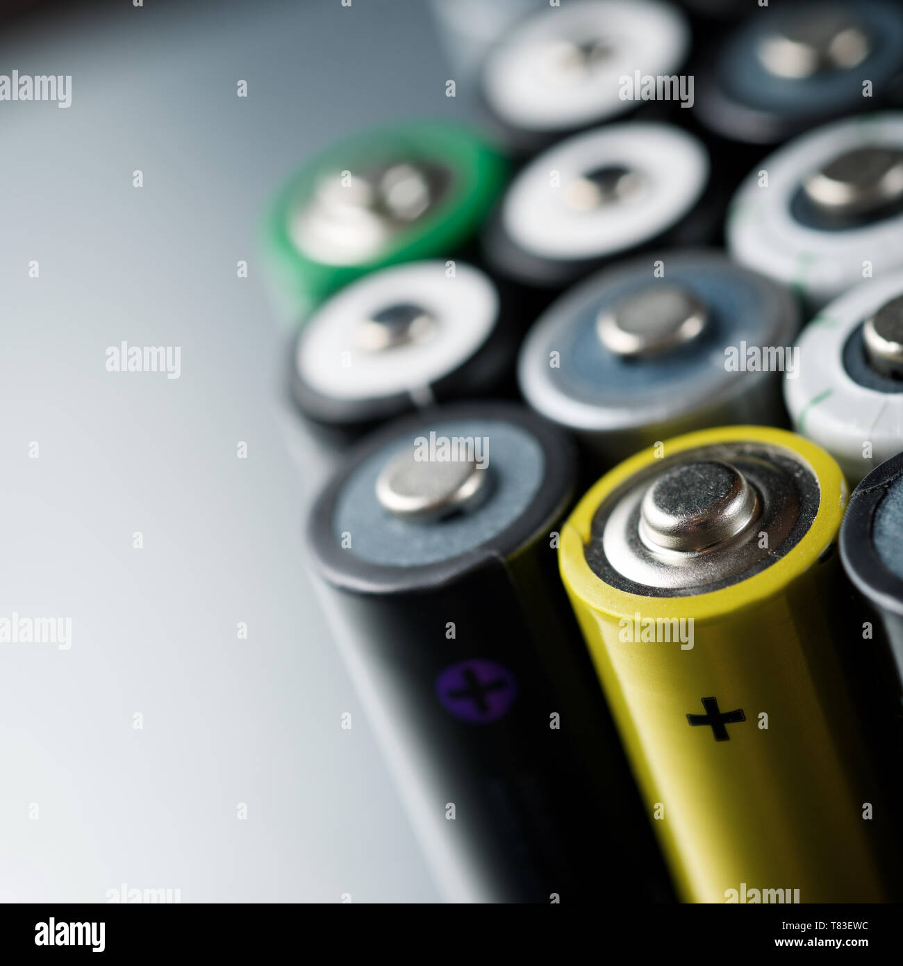 Many batteries on a metal table Stock Photo - Alamy