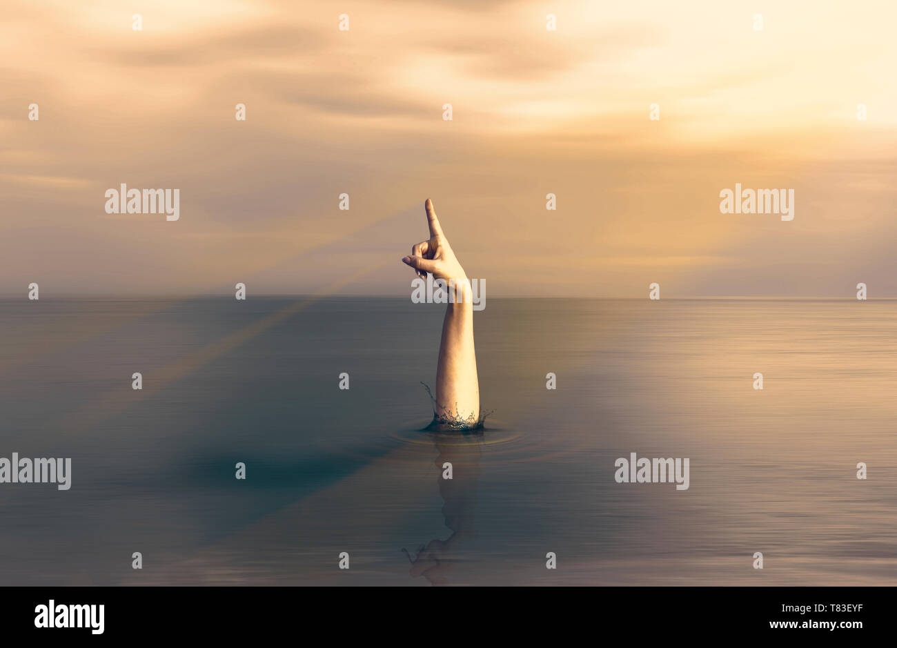 hand that emerges from the water and pointing to the sky Stock Photo ...