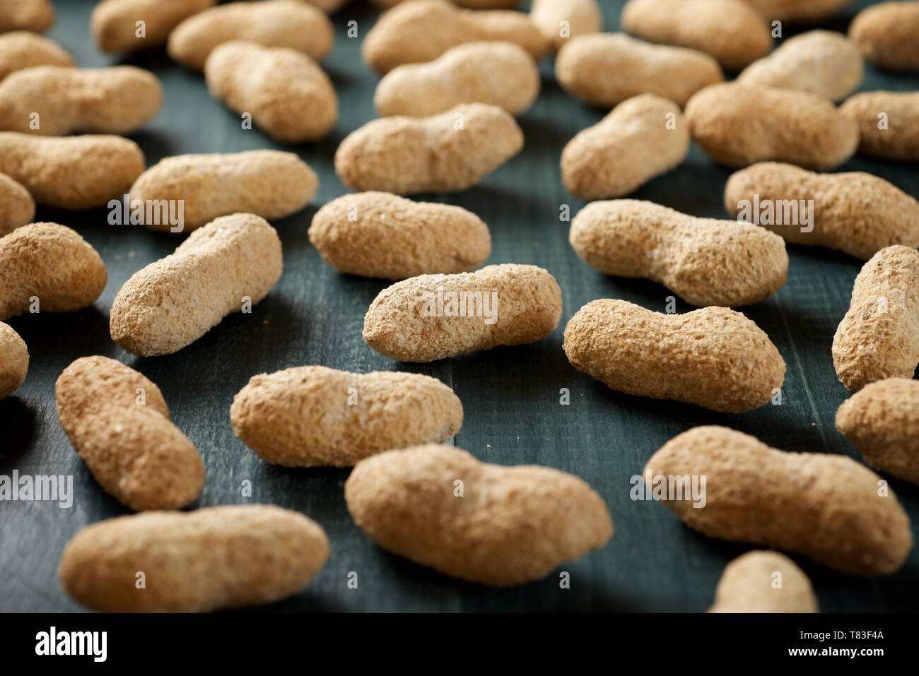 Peanuts with shell on a table Stock Photo - Alamy