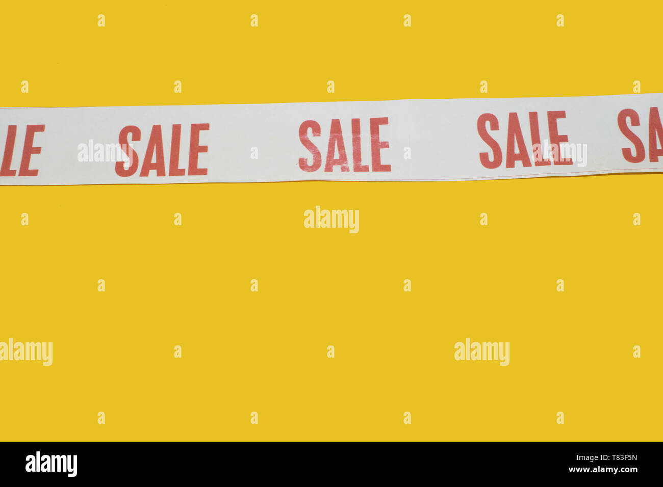SALE sign across a yellow background Stock Photo - Alamy