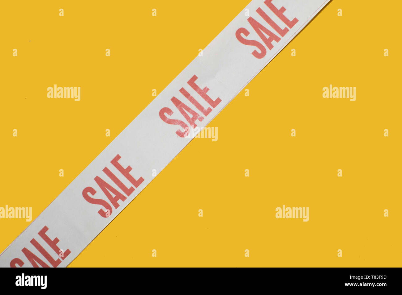 SALE sign across a yellow background Stock Photo - Alamy