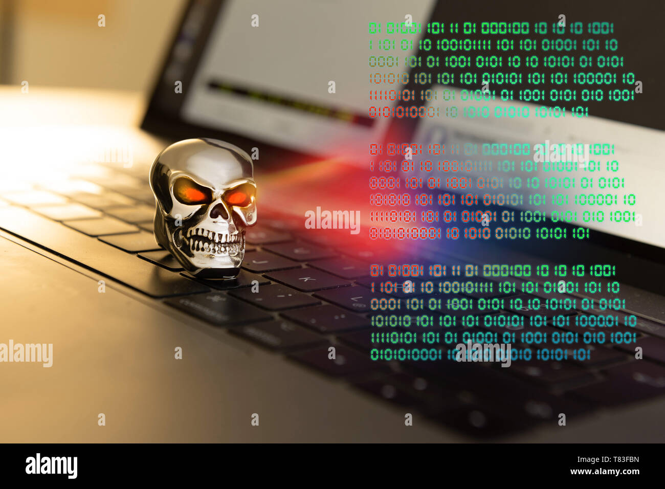 Skull with glowing eyes on a keyboard changes a virtual binary code ...
