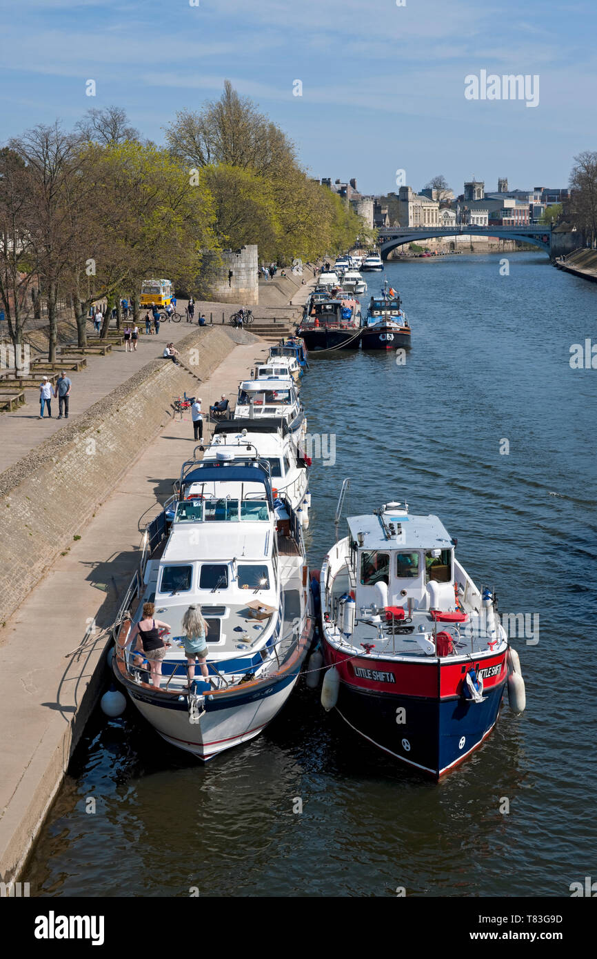 Pleasure boats boat moored along the riverside River Ouse in spring ...