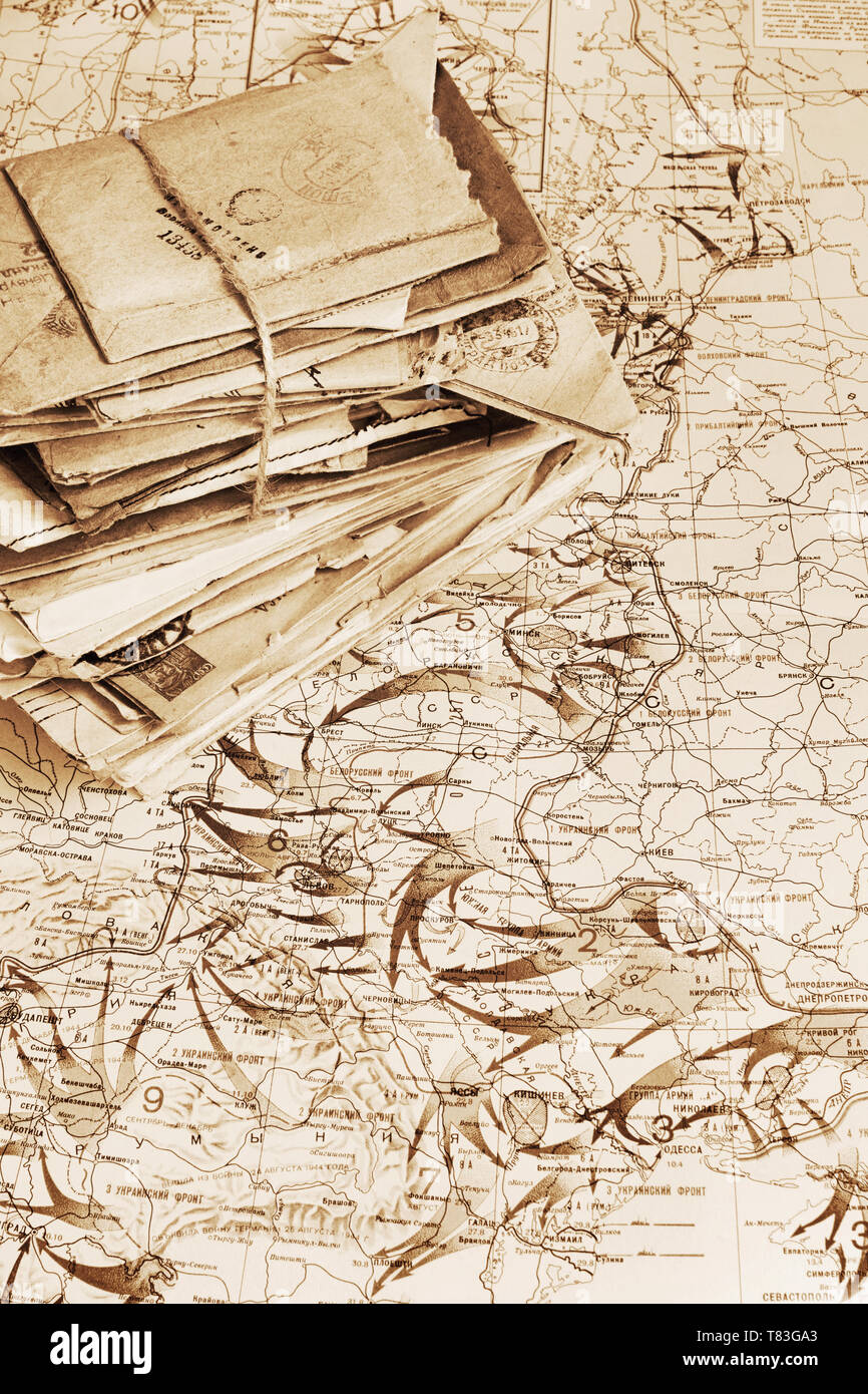 Sheaf of the paper letters of the wartime lying on the military map of ...