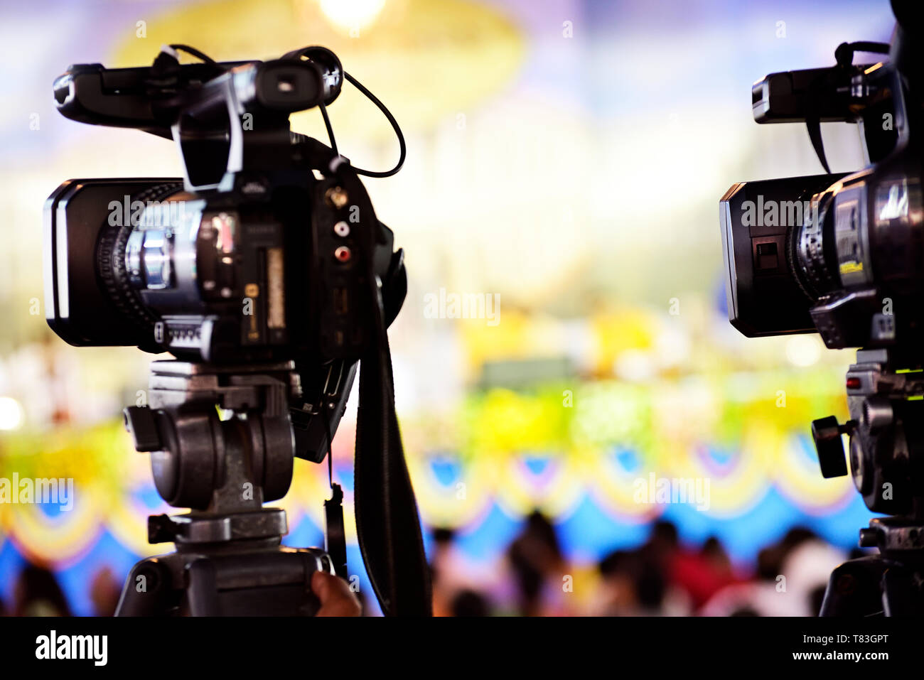 Video journalist capturing moving picture by camcorder in a event Stock ...