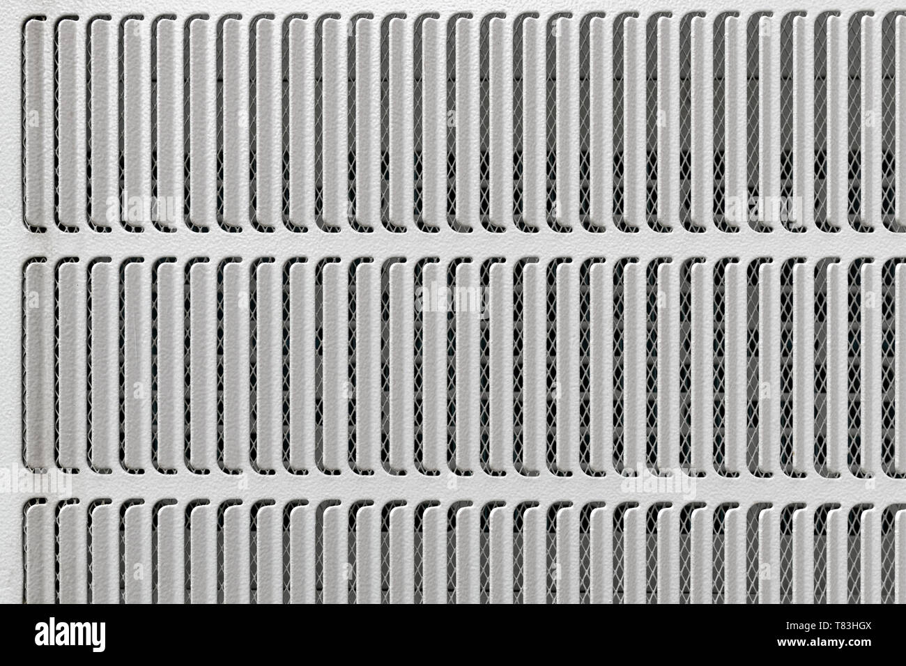 Slotted metal plate pattern as background, texture of white metallic ...