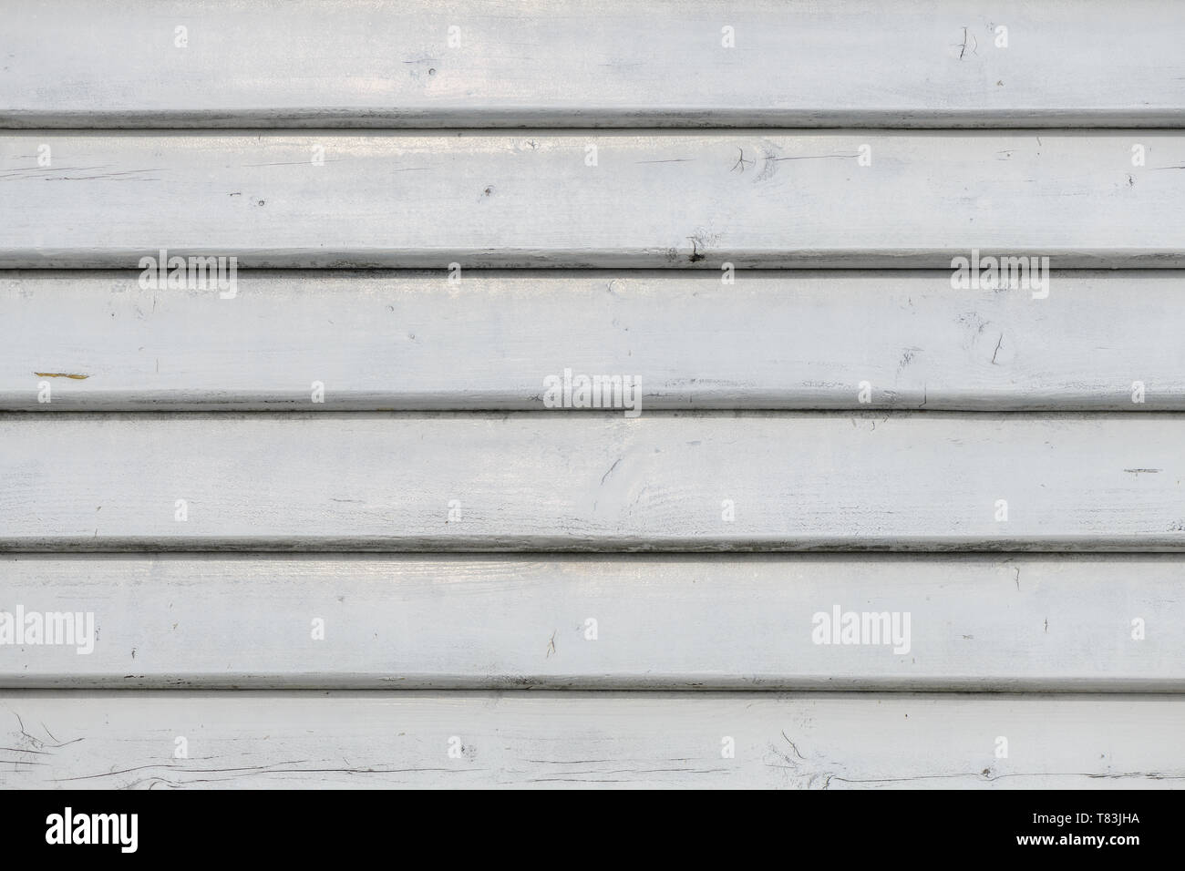 White vintage wooden boards in overlap cladding pattern, front view as ...