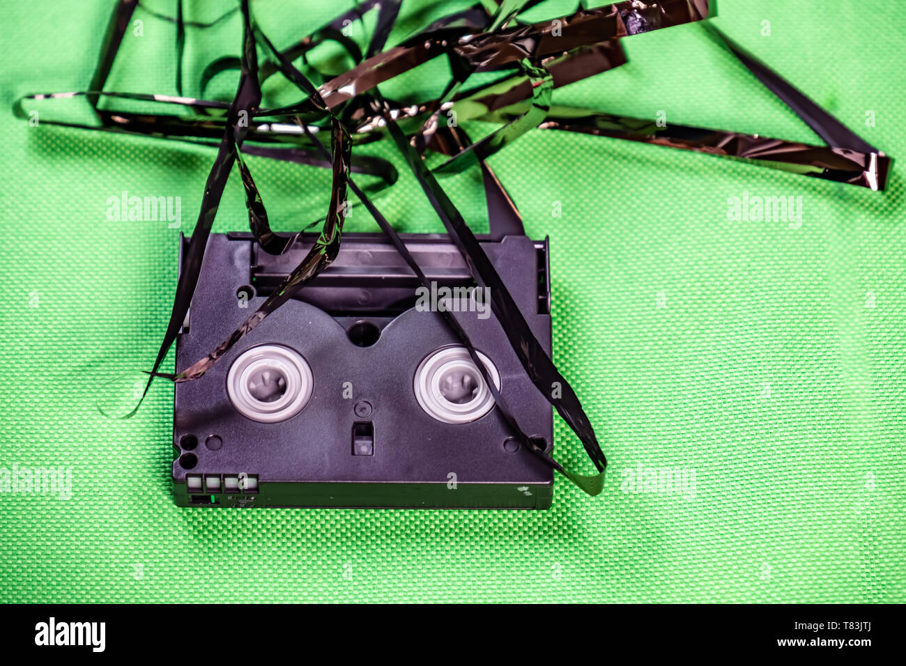 Tape pulled out from mini dv format video cassette tape Stock Photo - Alamy