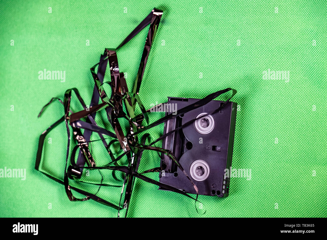 Tape pulled out from mini dv format video cassette tape Stock Photo - Alamy