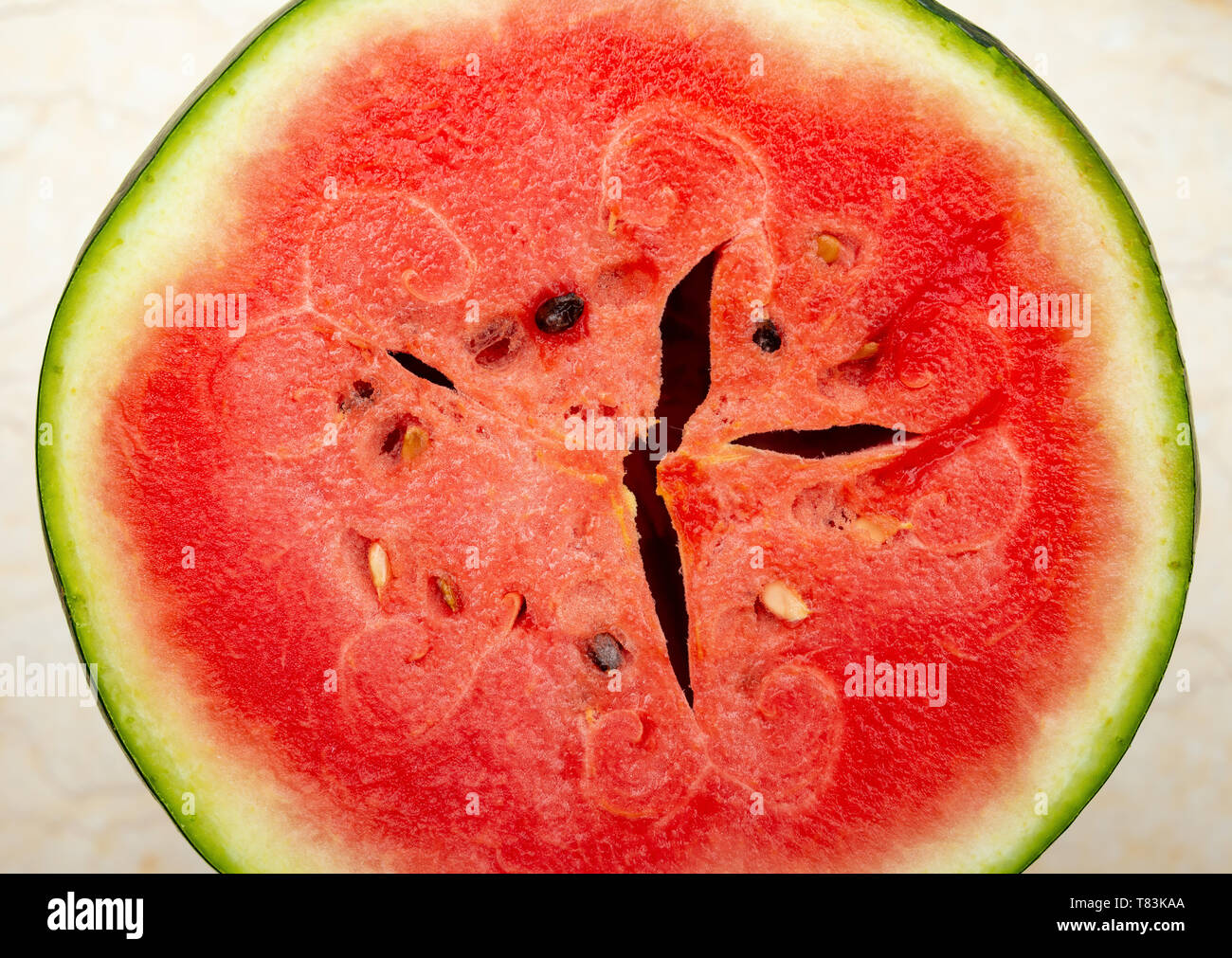 cut out section of an overripe watermelon as background and texture ...