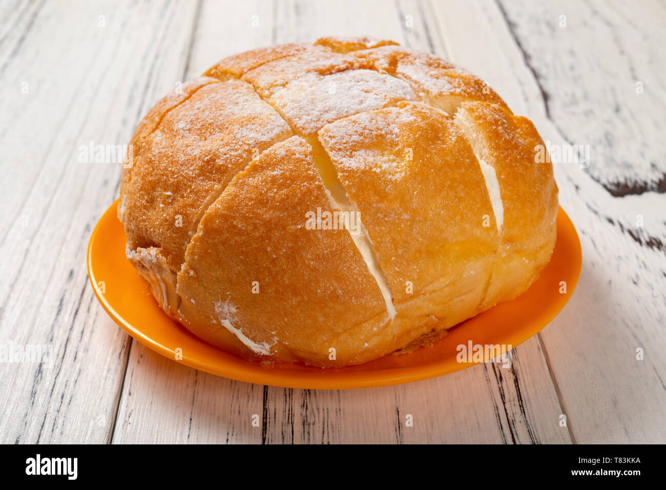 side view bread with cream inside on wood table Stock Photo - Alamy