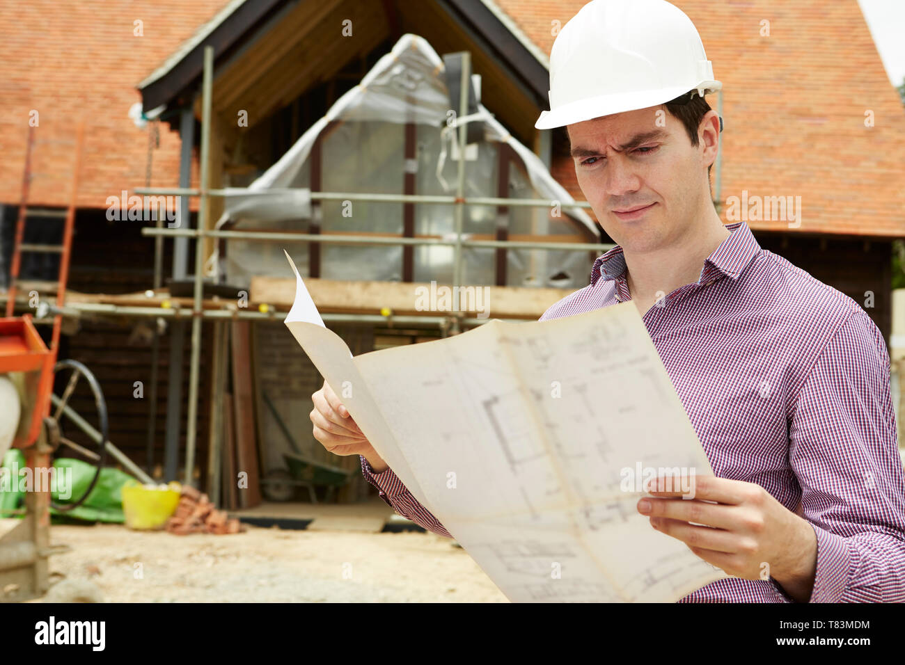 An architect looking at blueprint plans hi-res stock photography and ...