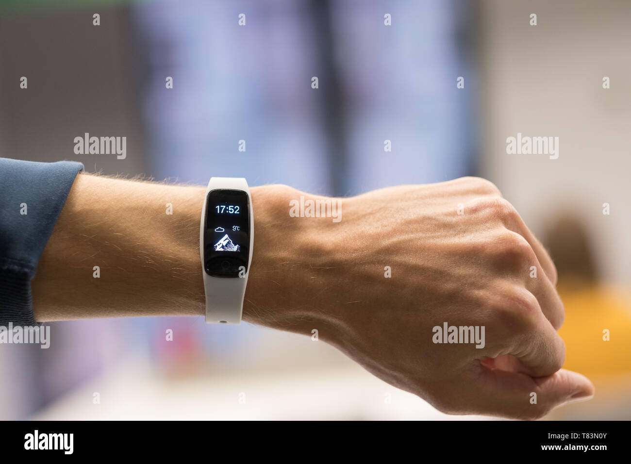 Runner checking progress on smart watch. Fit male runner exercise ...