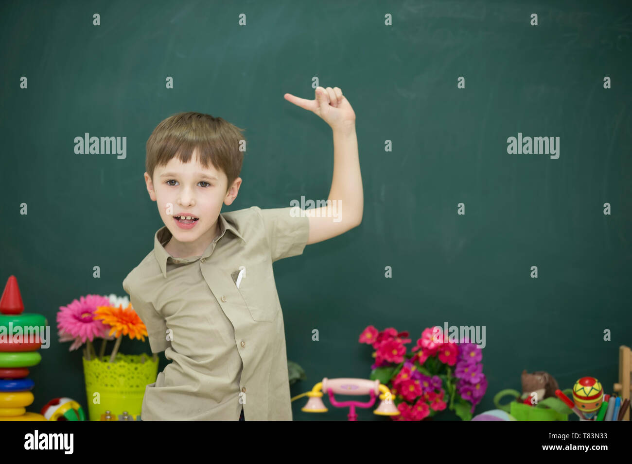 The child points to the board with his finger Stock Photo - Alamy