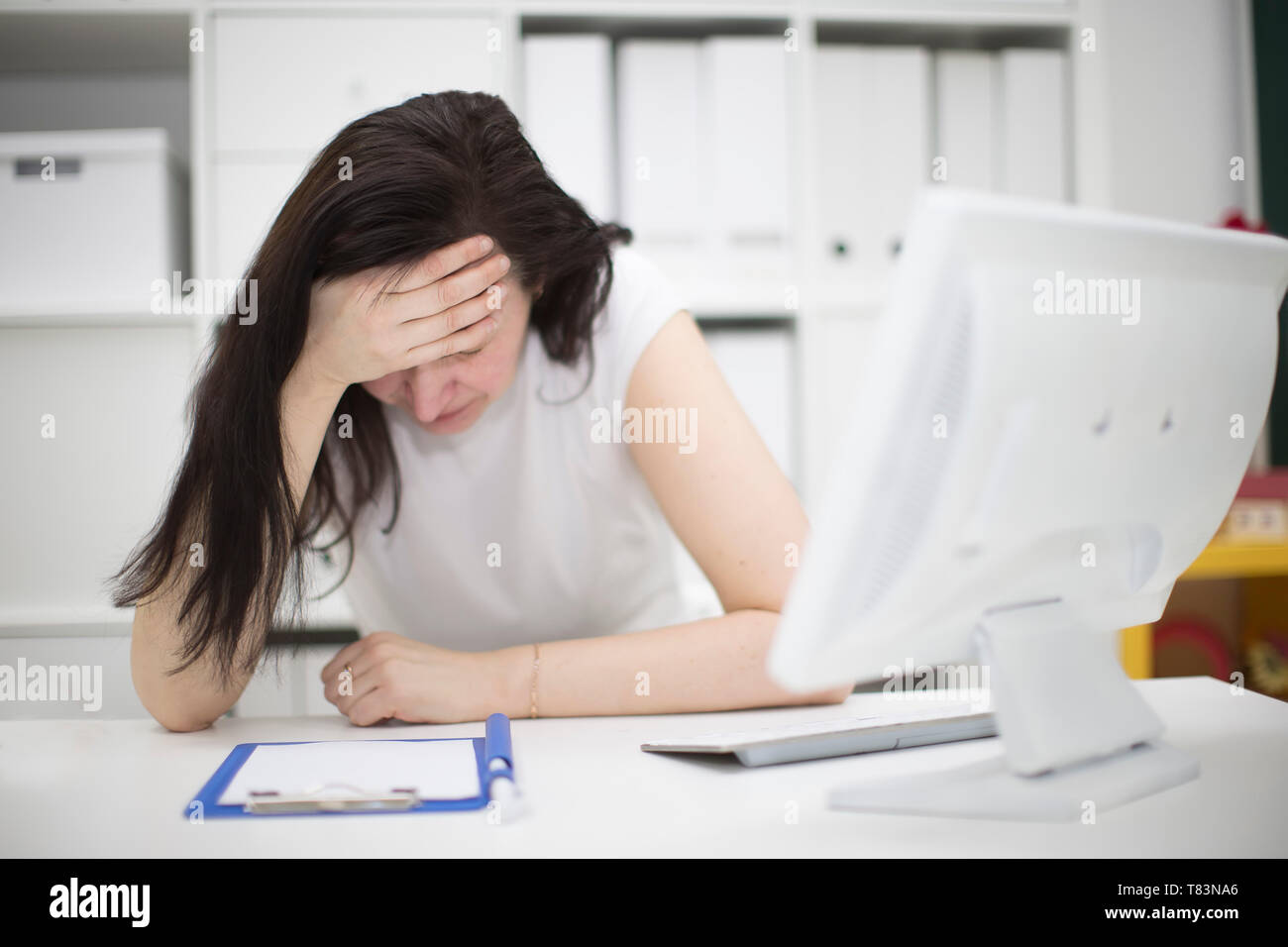 Tired woman at the computer Stock Photo - Alamy