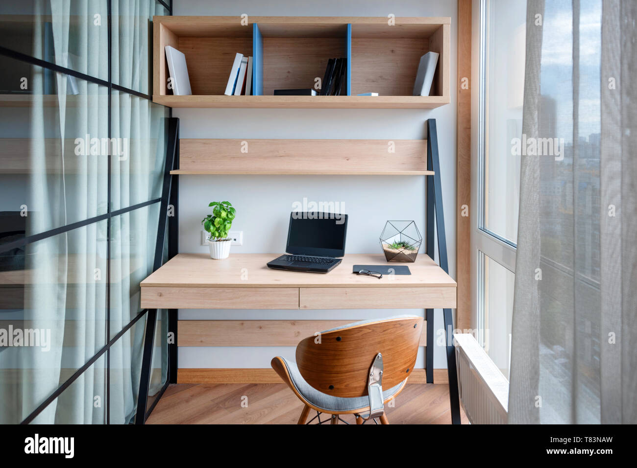Workplace with laptop on the table. Comfortable work table in office ...