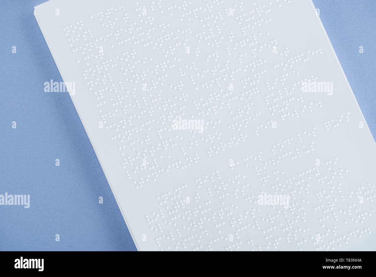 braille text on white paper isolated on violet with copy space Stock ...