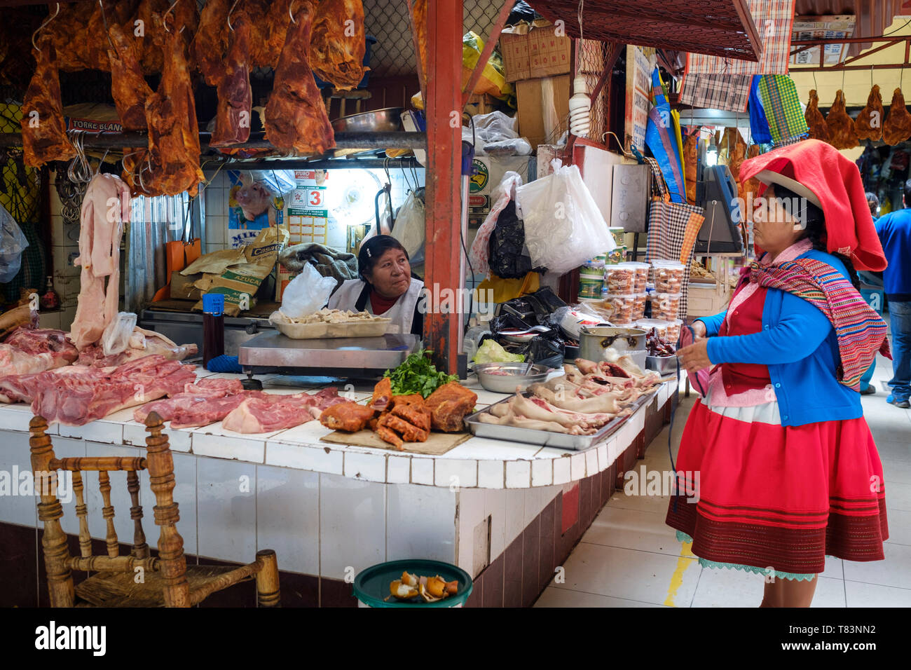 Woman in local dress at a beef meat stall in the Central Market or ...