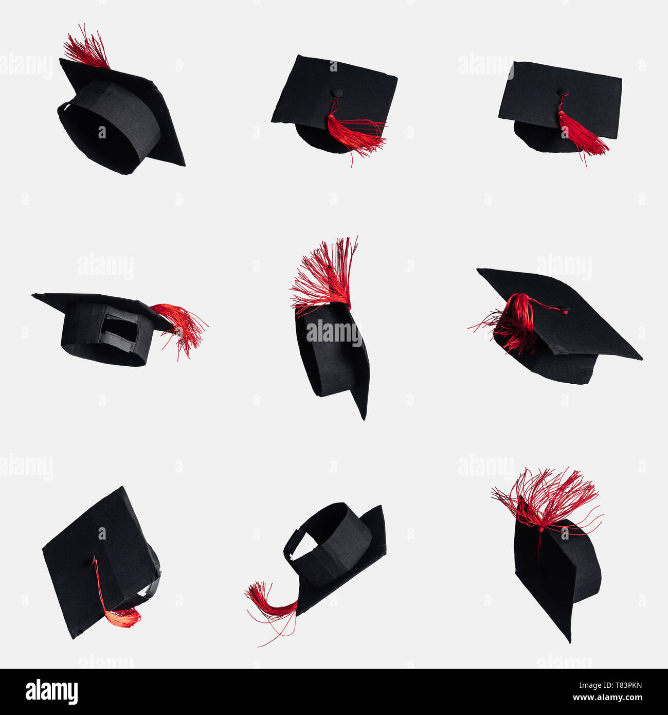 Black academic caps with red tassels isolated on white Stock Photo - Alamy